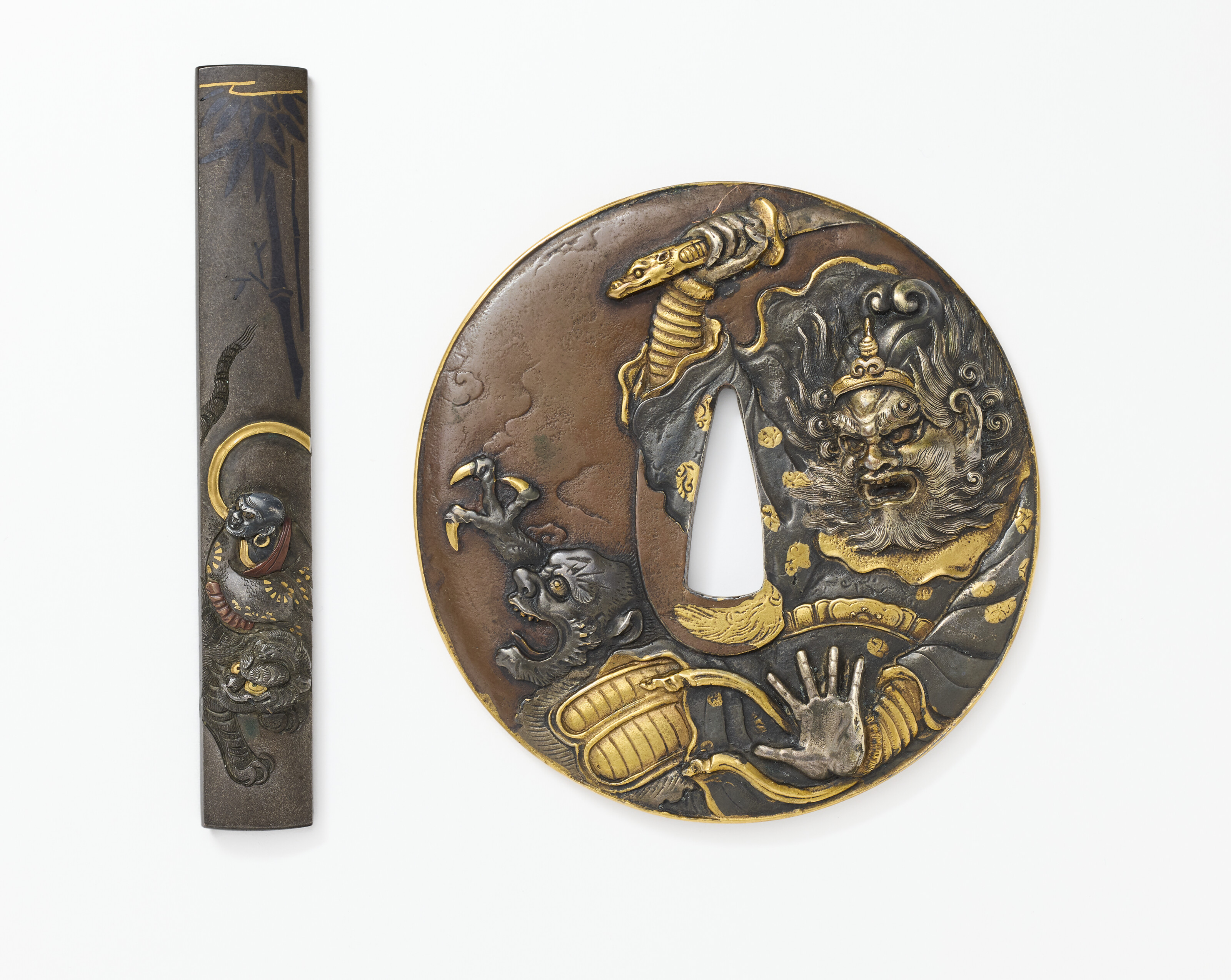 A SOFT-METAL-INLAID METAL TSUBA WITH SHOKI AND A KOZUKA, JAPAN, EDO ...