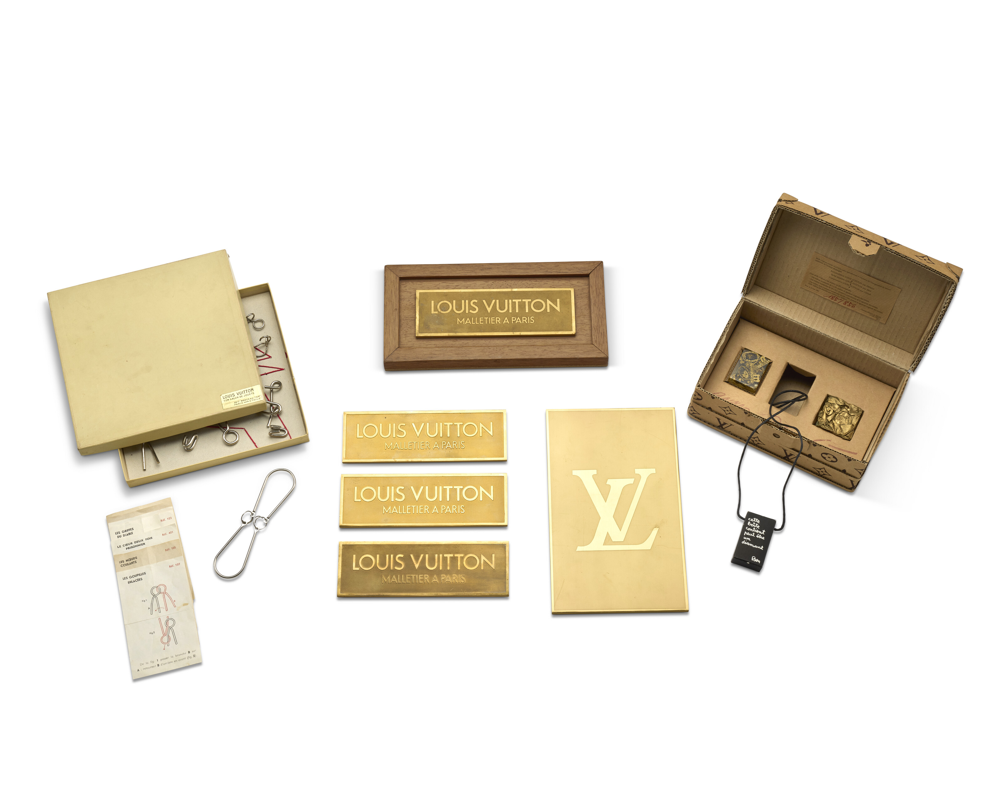 A GROUP OF SEVEN: A PUZZLE BOX GAME, FIVE BRASS METAL BRANDED LOGO ...