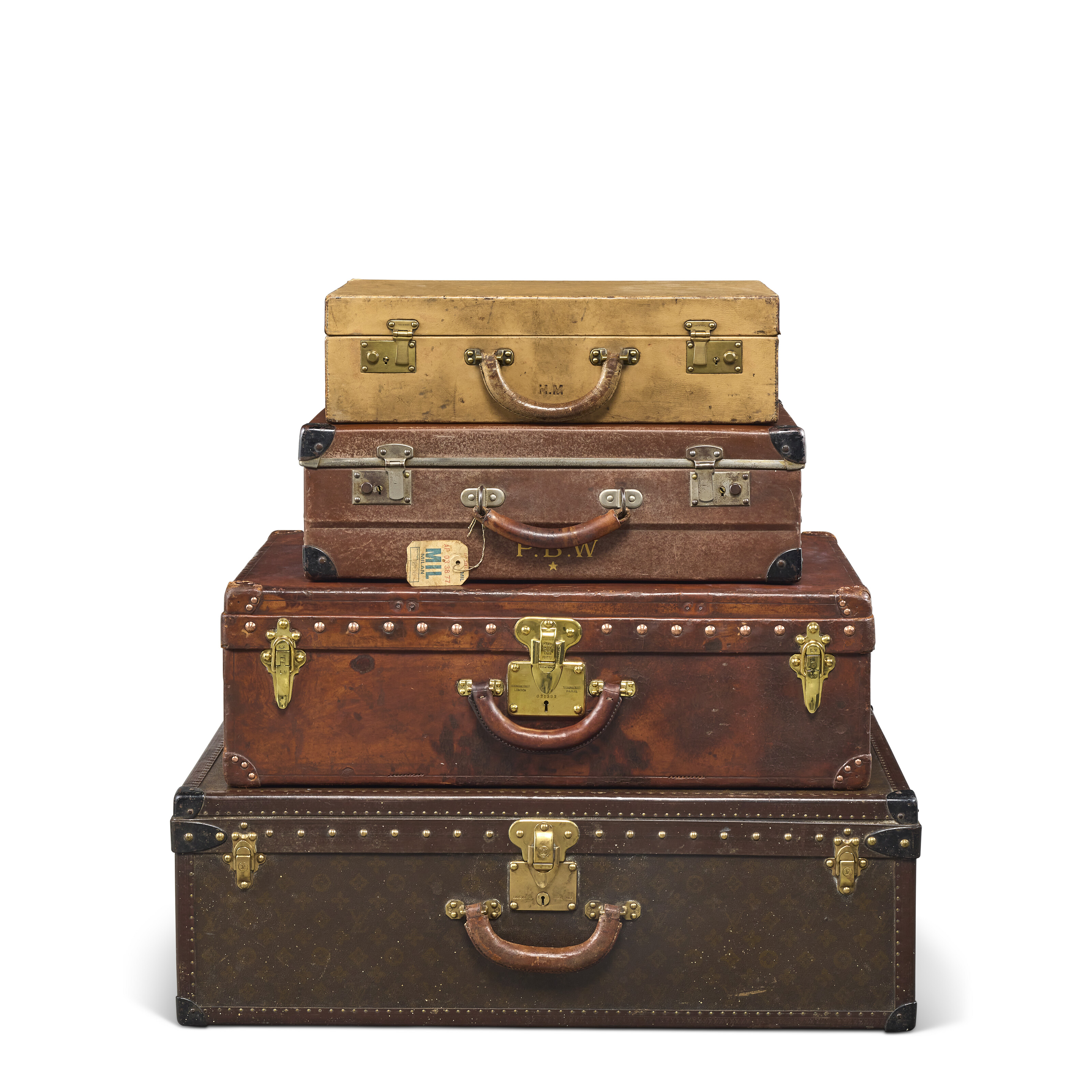A GROUP OF FOUR: A BEIGE COATED LEATHER SUITCASE WITH BRASS HARDWARE, A ...