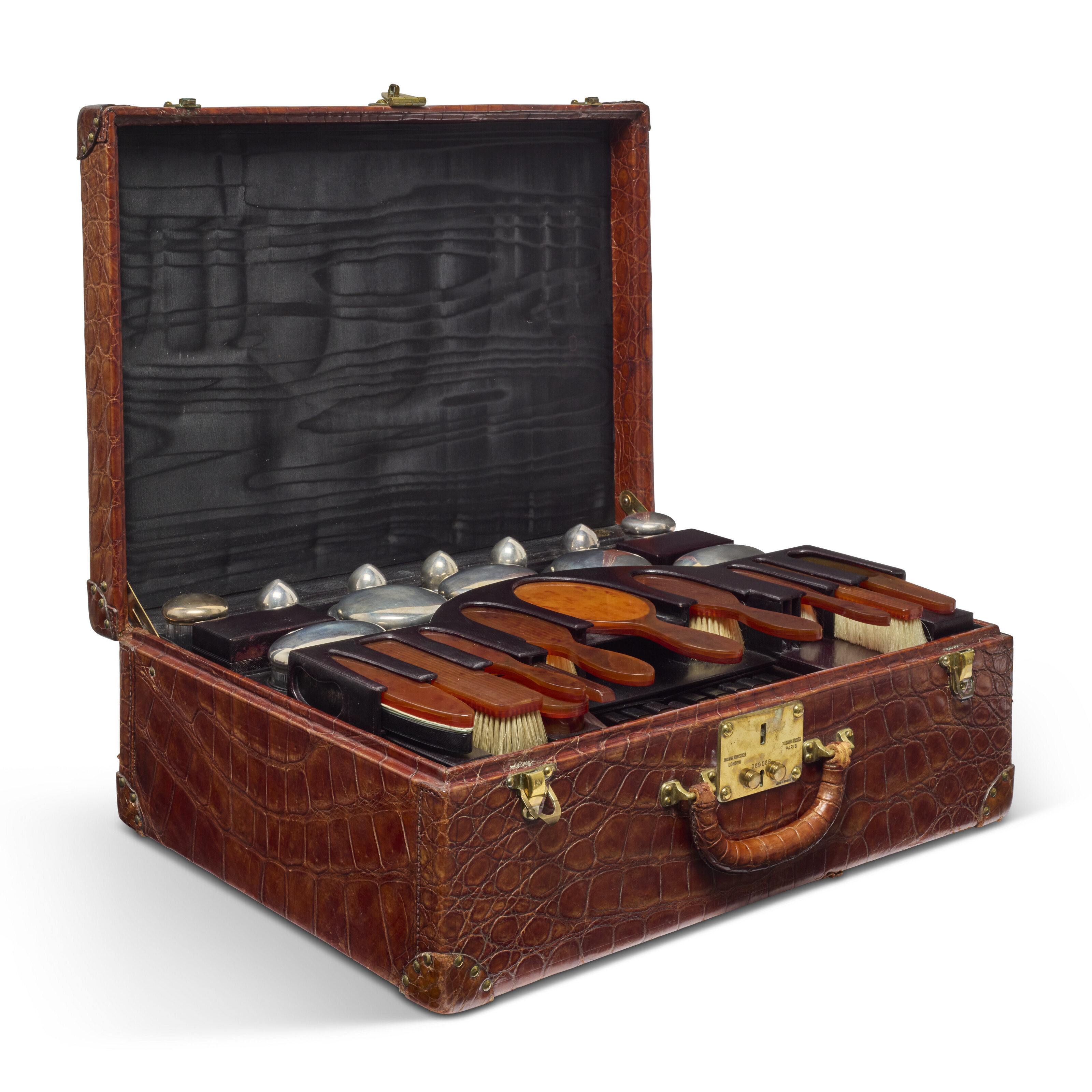 A SHINY BROWN POROSUS CROCODILE & TORTOISE SHELL TOILETRY KIT TRUNK ...