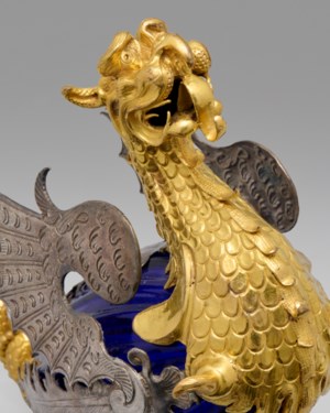 A PAIR OF SILVER AND GILT-COPPER MOUNTED BLUE GLASS DRAGONS, ITALIAN ...