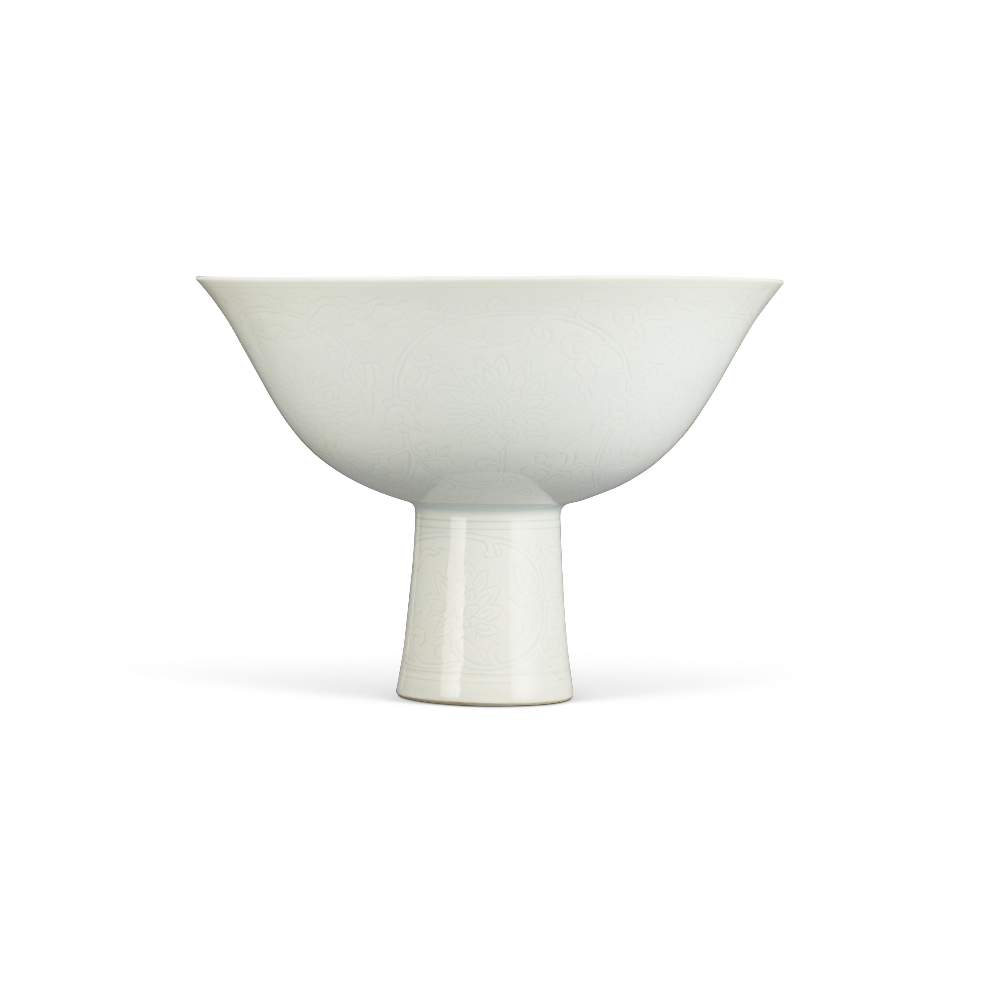 A WHITE-GLAZED ANHUA-DECORATED 'LOTUS' STEM BOWL, QIANLONG INCISED SIX ...