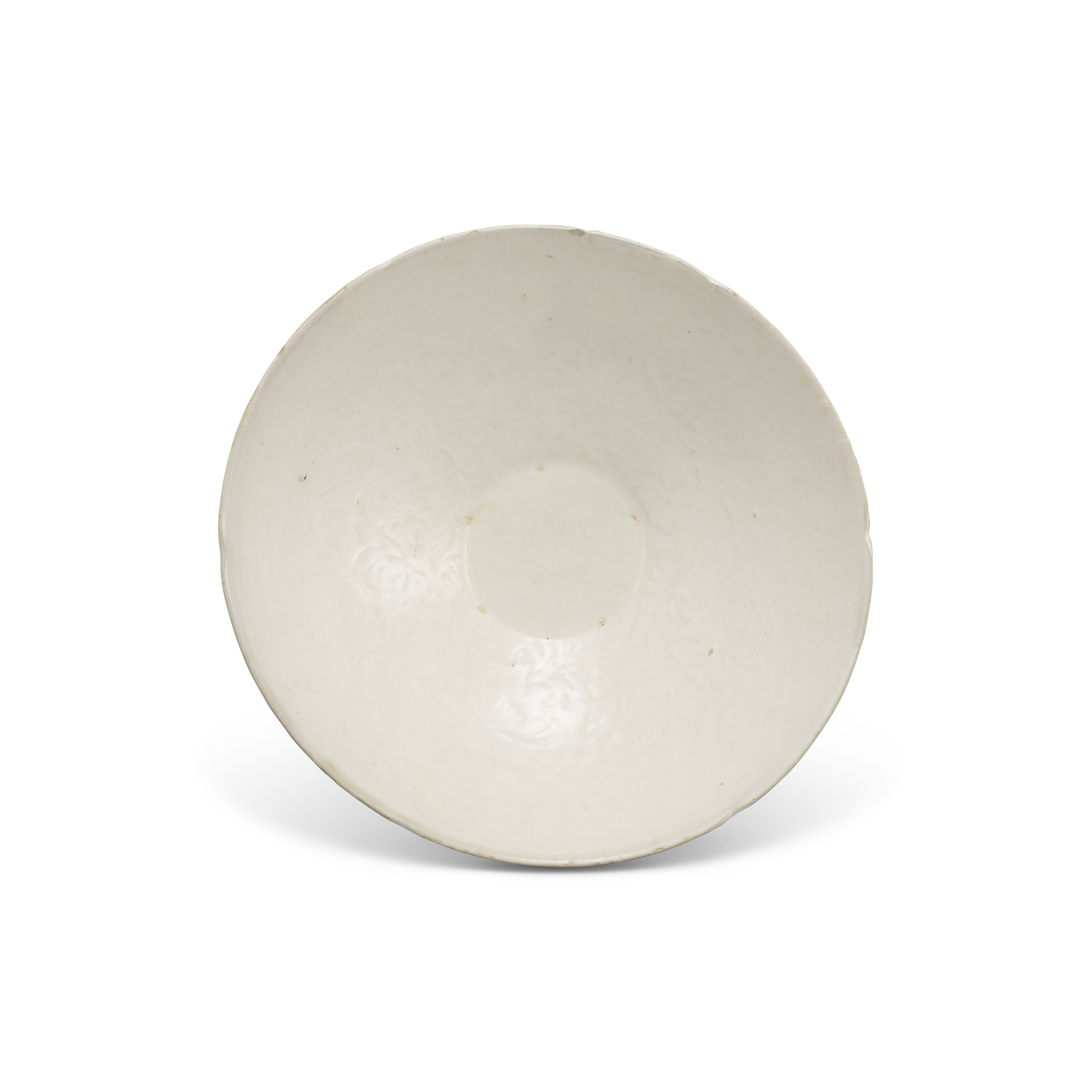 A LARGE CIZHOU-TYPE CREAM-GLAZED MOULDED AND LOBED 'FLORAL' BOWL ...
