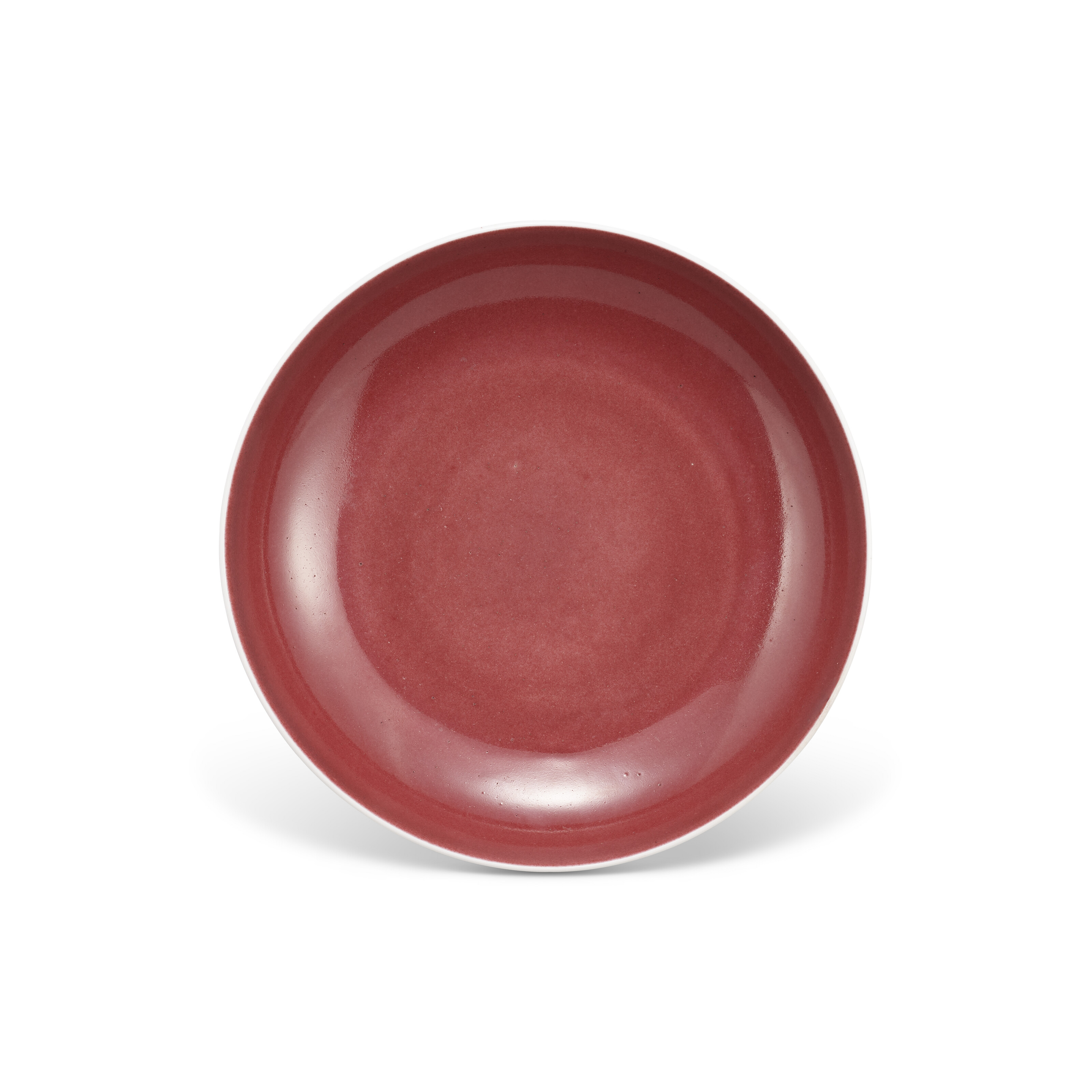 A COPPER-RED GLAZED DISH, QIANLONG SIX-CHARACTER SEAL MARK IN ...