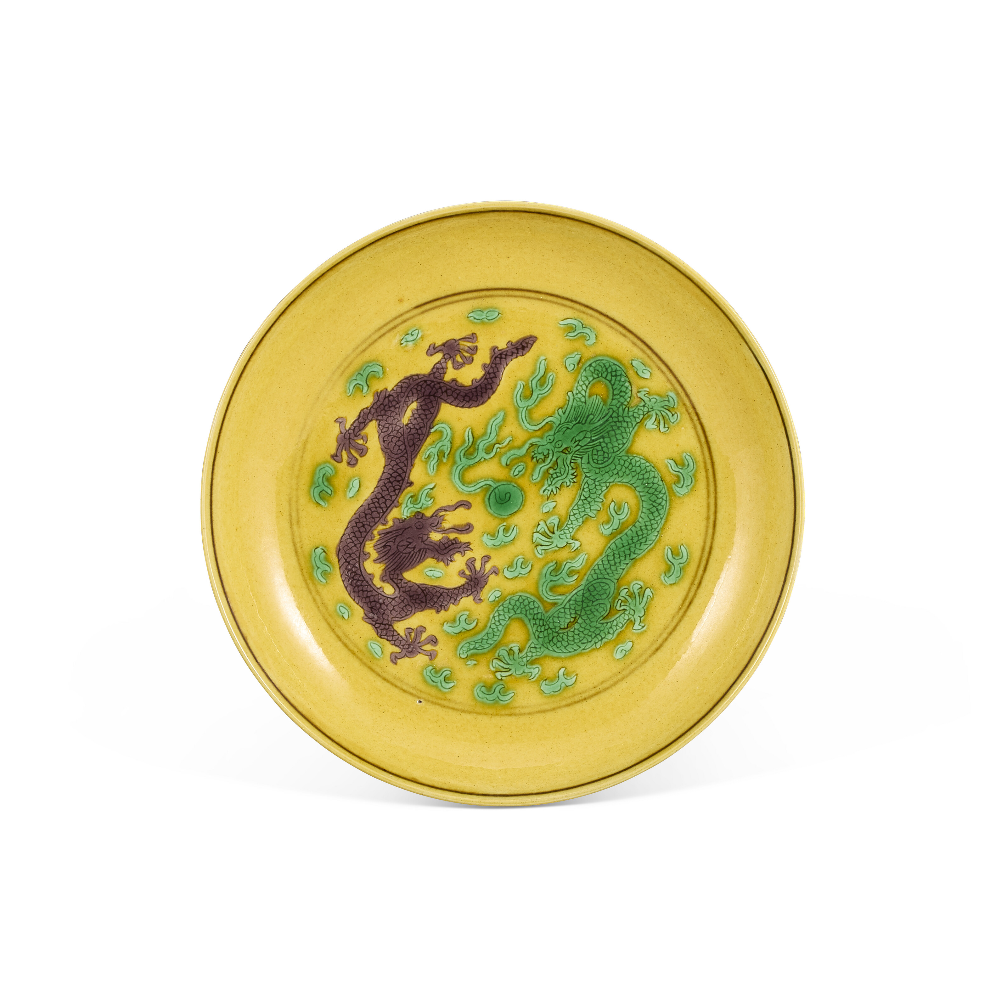 A YELLOW-GROUND GREEN AND AUBERGINE ENAMELLED 'DRAGON' DISH, JIAQING ...