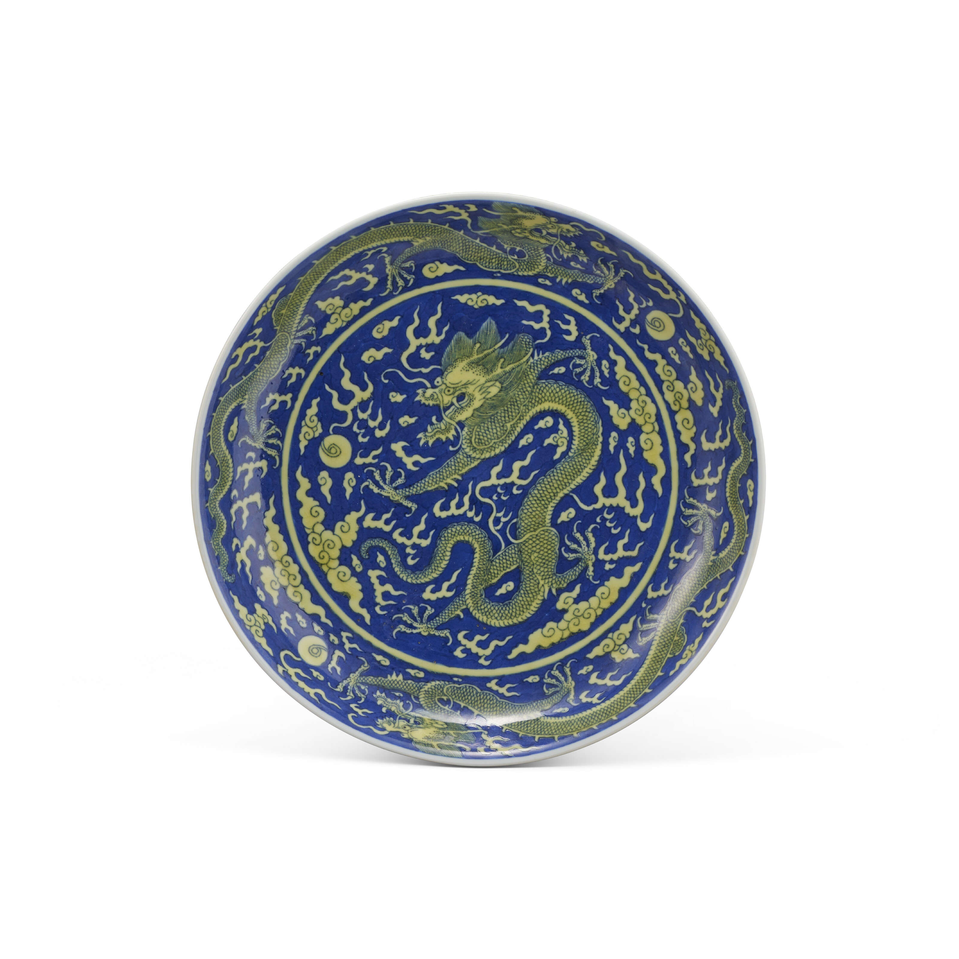 A BLUE GROUND AND YELLOW-ENAMELLED ‘DRAGON’ DISH, JIAQING SIX-CHARACTER ...