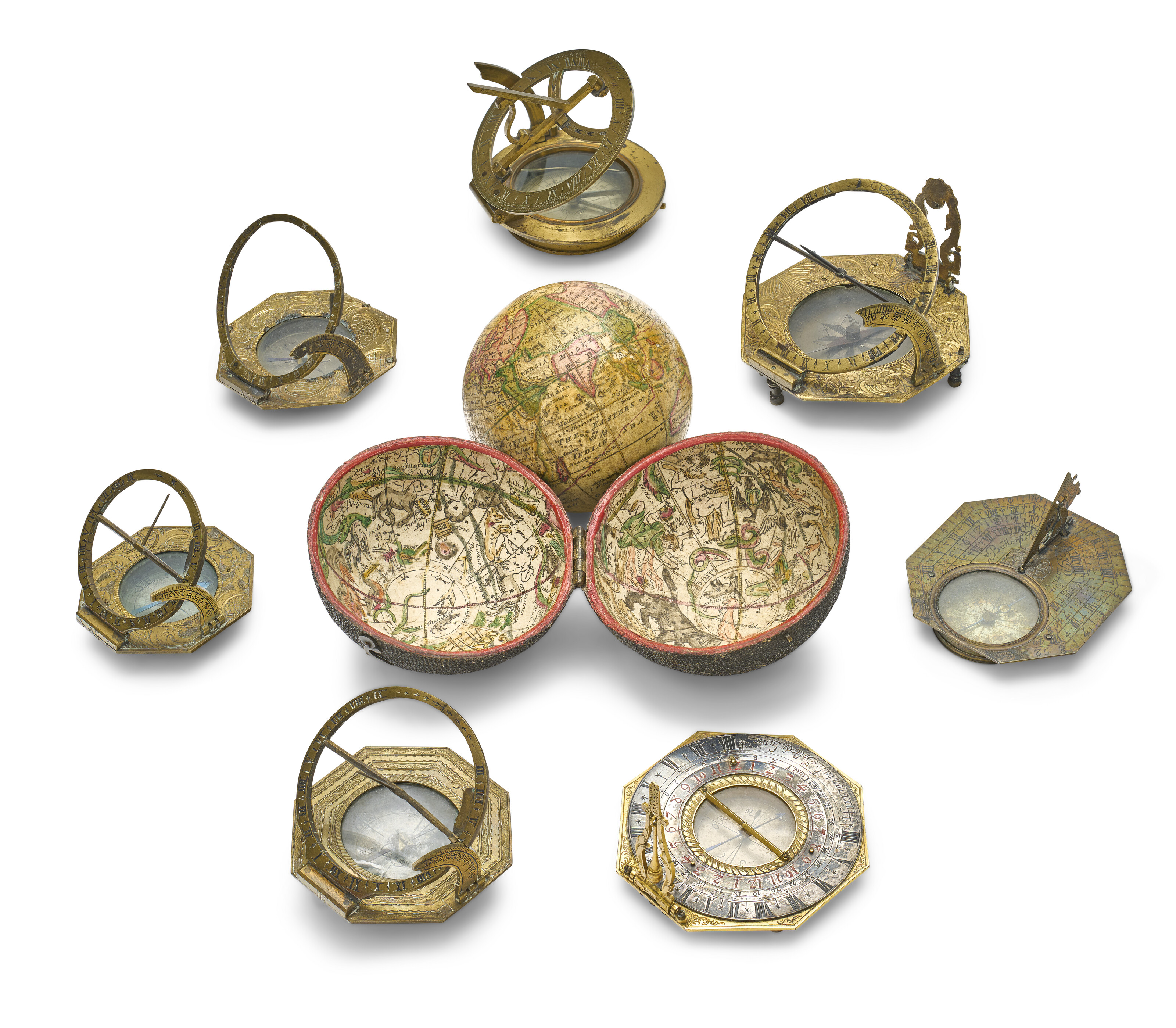 SEVEN ENGLISH AND FRENCH BRASS COMPASS SUNDIALS AND A POCKET GLOBE ...