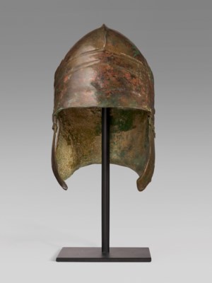 A GREEK BRONZE CHALCIDIAN HELMET, MAGNA GRAECIA, LATE CLASSICAL TO ...