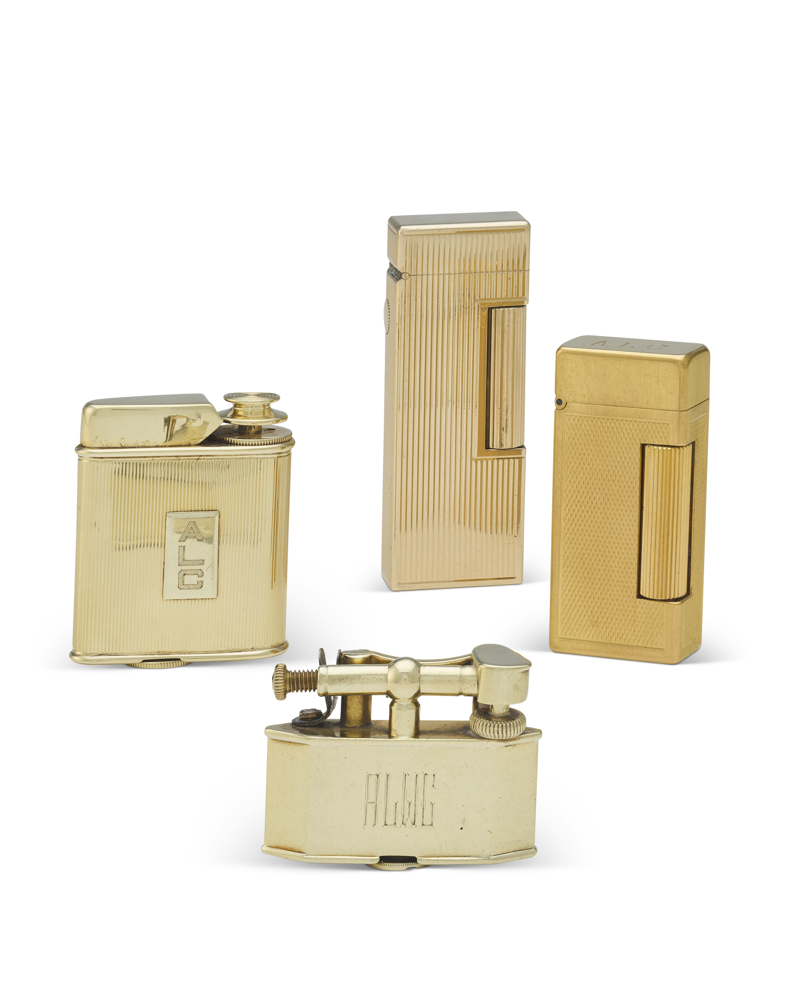 TWO GOLD LIGHTERS AND A GOLD PERFUME ATOMIZER, THE LIGHTERS MARK OF ...