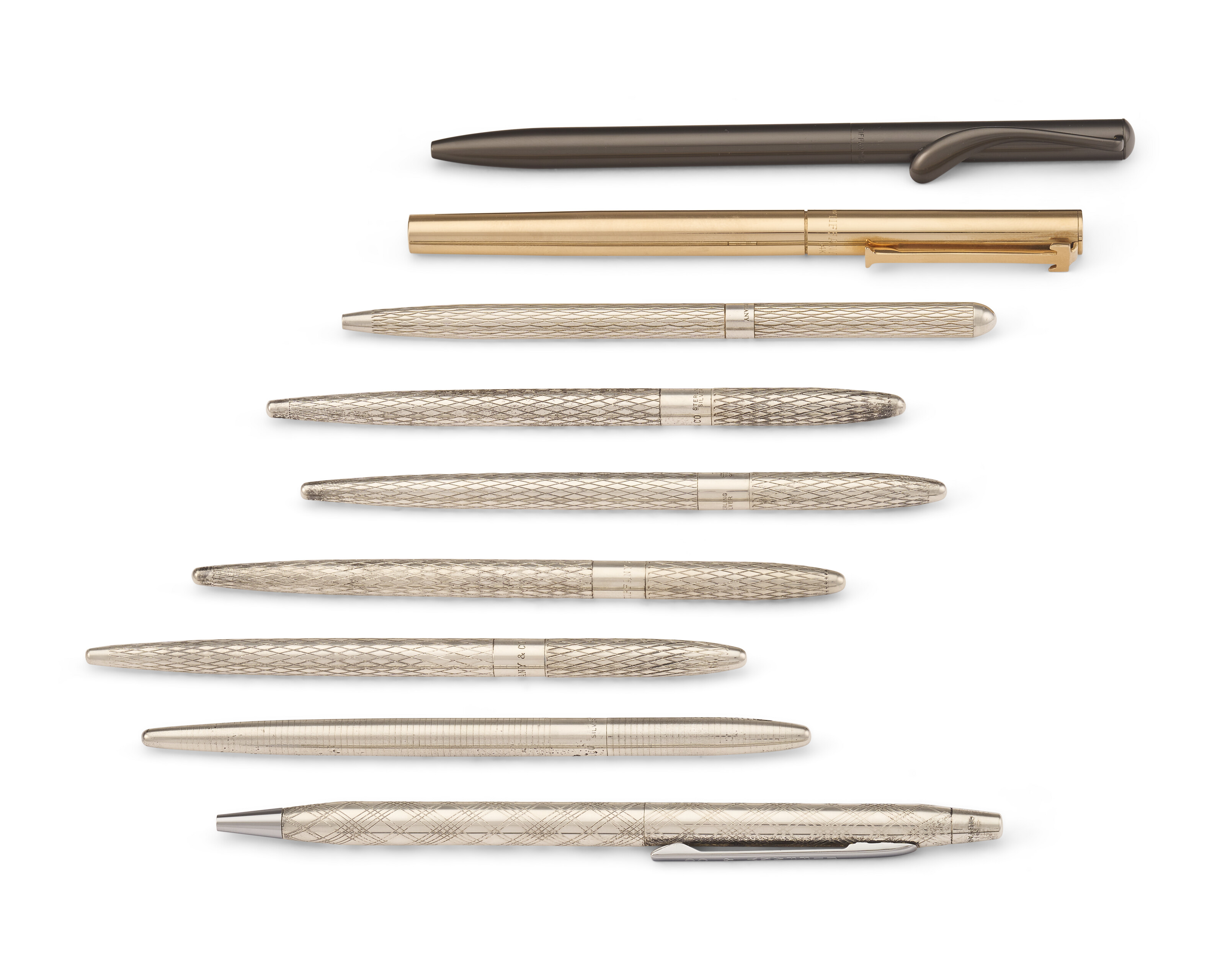 A GROUP OF NINE AMERICAN GOLD, SILVER, AND METAL PENS, MARK OF TIFFANY ...