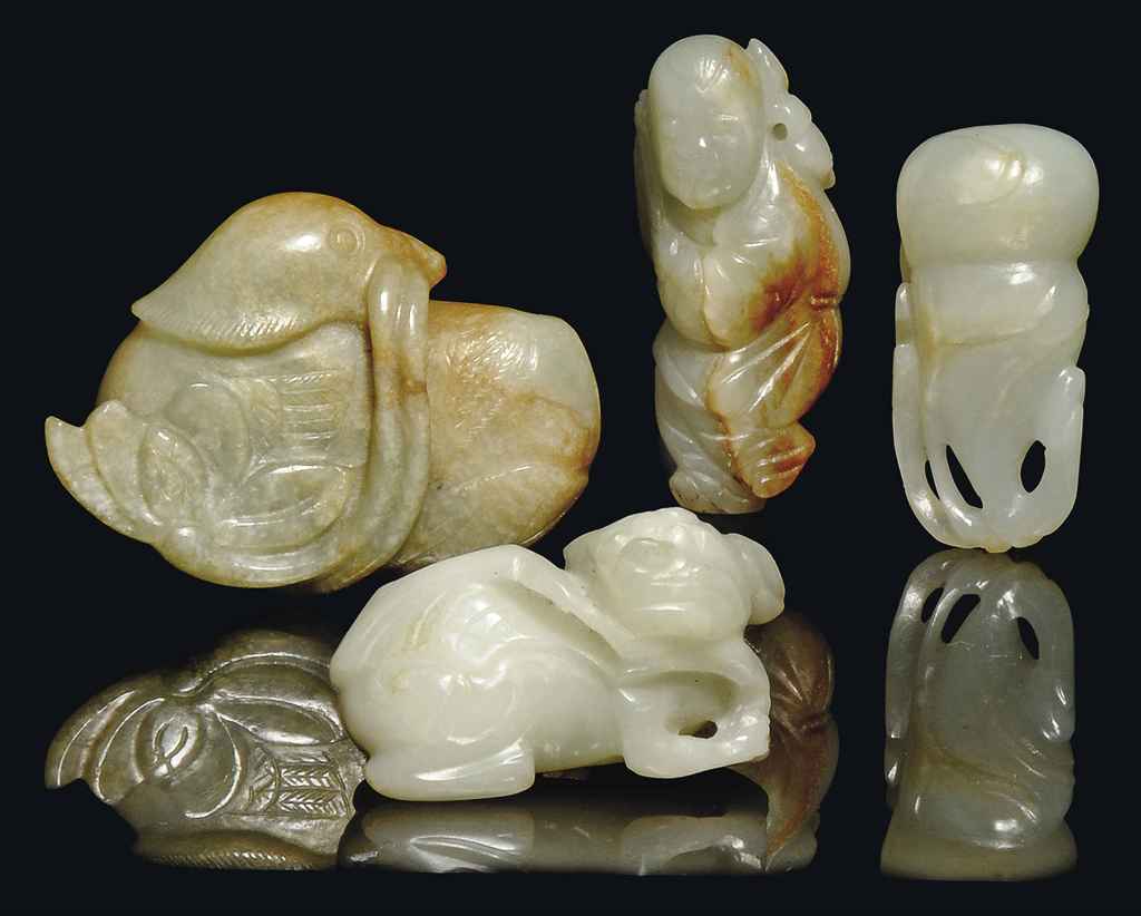 Four Chinese jade carvings of standing elephants -- 3.in.long max; two ...
