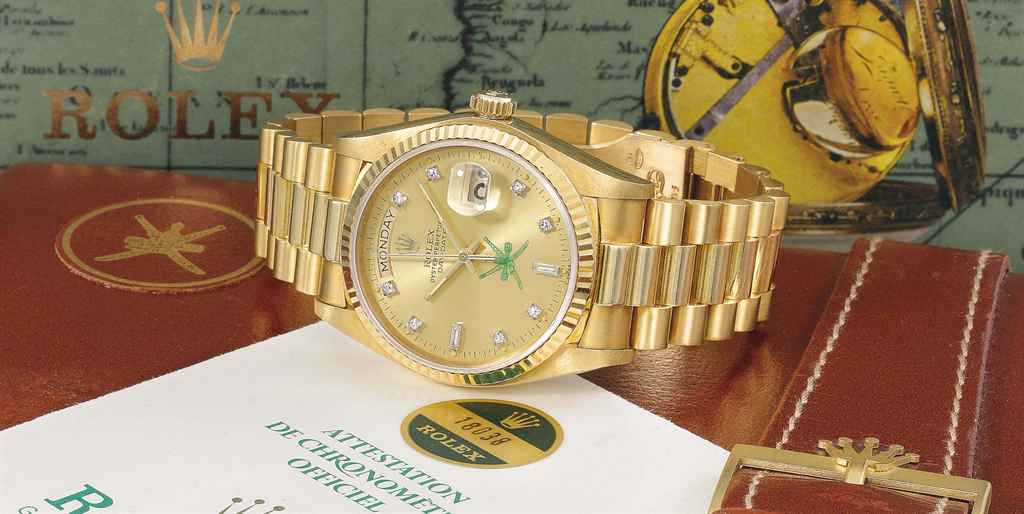Rolex A rare and attractive 18K gold and diamond-set automat ...