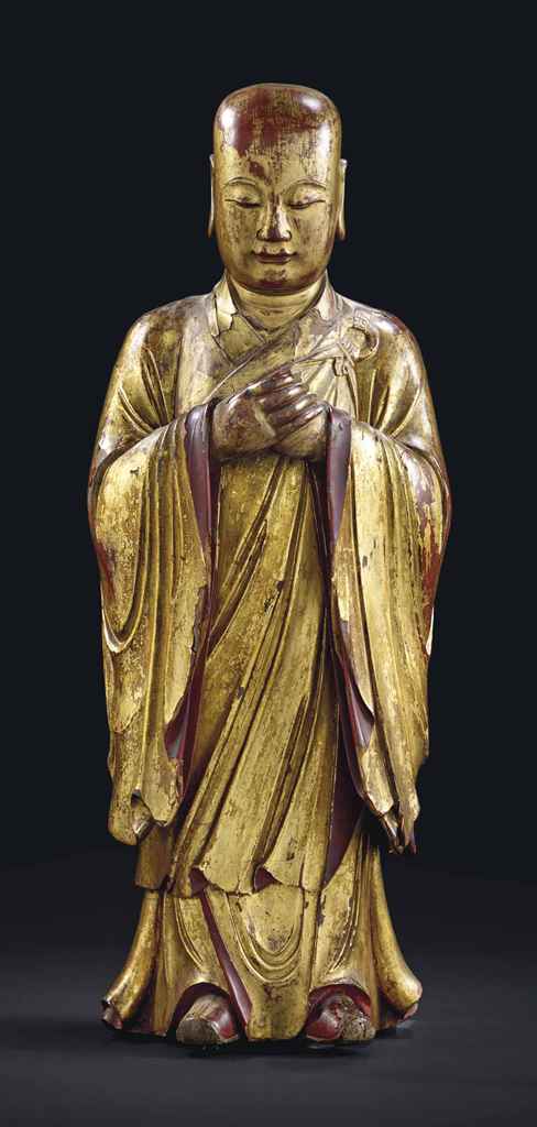 STATUE DE LUOHAN EN BOIS LAQUE ROUGE ET OR - auctions & price archive