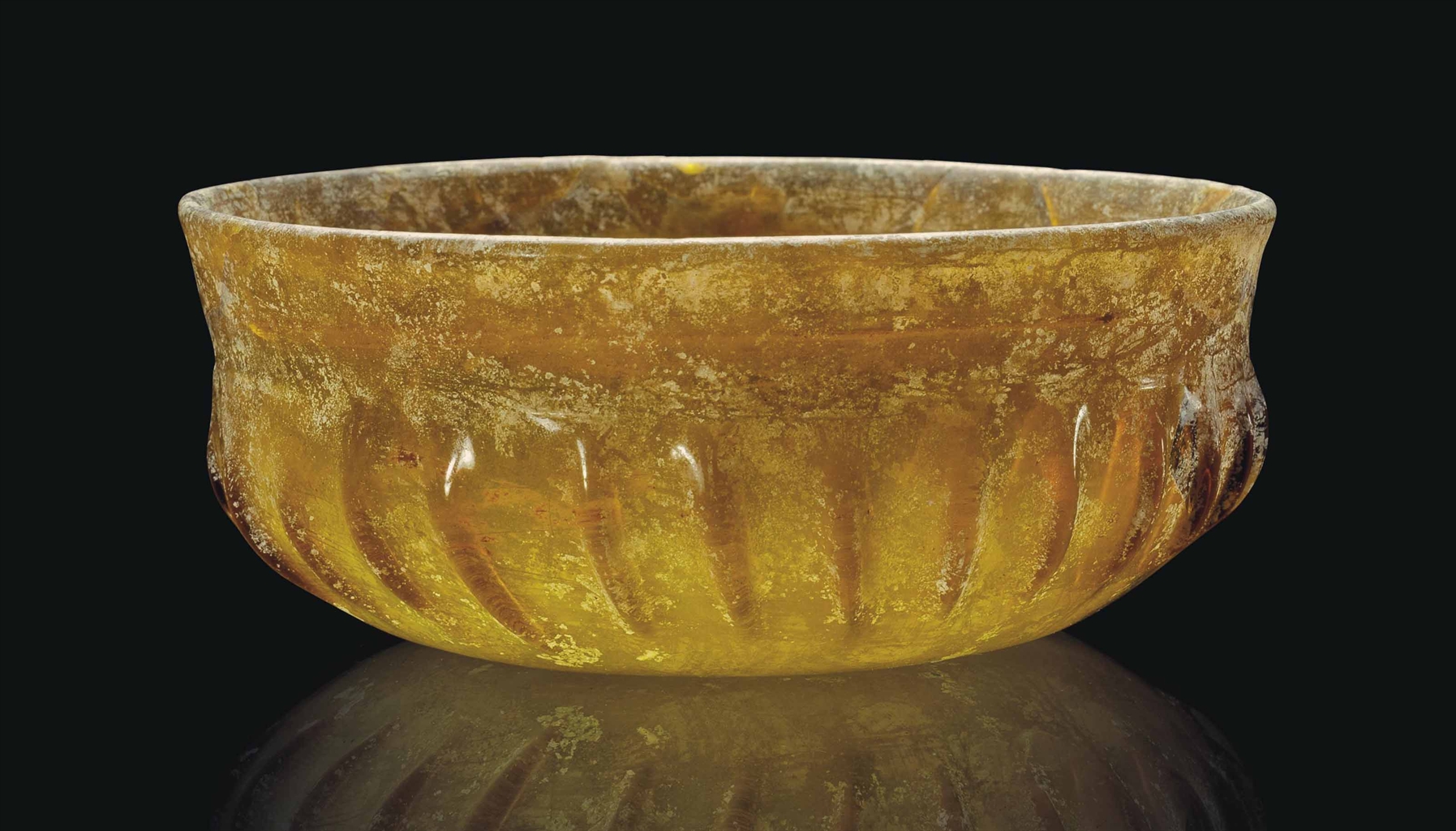 A ROMAN RIBBED GLASS BOWL | CIRCA LATE 1ST CENTURY B.C.- EARLY 1ST ...
